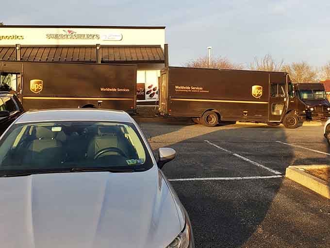 Even the delivery trucks know where the good stuff is, lined up like they're waiting for their own chocolate fix.