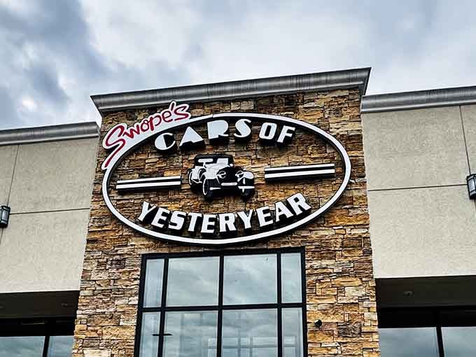 The signage glows with pride, marking this treasure trove where automotive history lives and breathes daily.