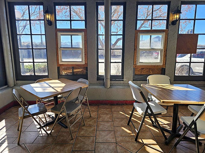 Sunlight streaming through tall windows onto simple tables: the perfect setting for an unforgettable taco experience today.