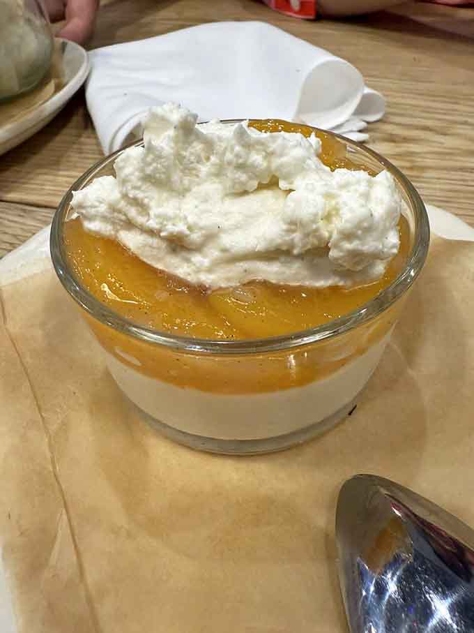 Peaches and cream pannacotta is like summer captured in a glass, topped with clouds of whipped cream you'll want to dive into.