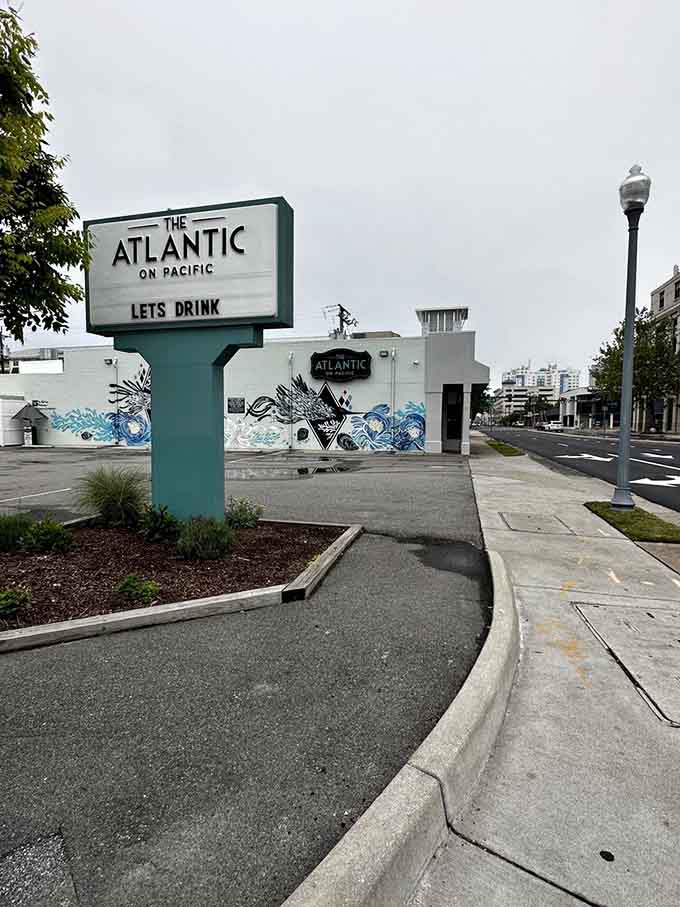Even the street sign knows what's important: good drinks and even better food await inside here.