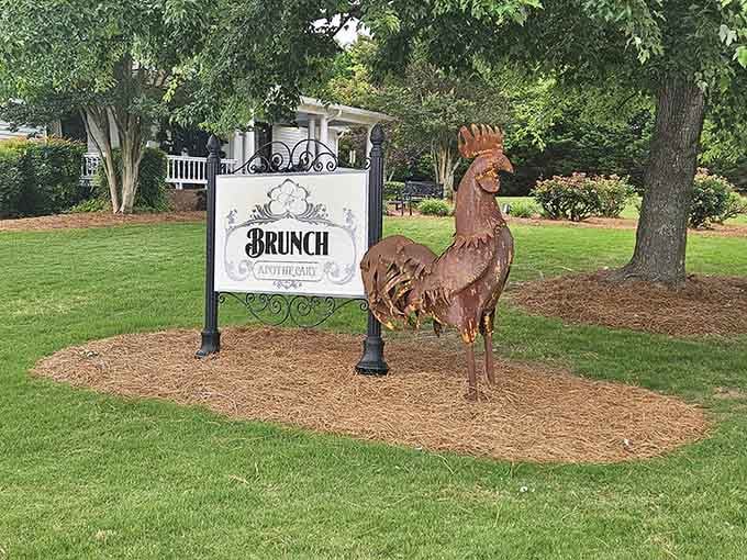 That metal rooster sculpture standing guard tells you this place has personality before you even walk through the door.