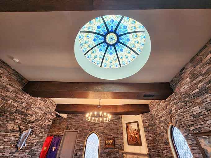 That decorative ceiling medallion adds artistic flair overhead, reminding you that castles never skimp on the architectural details anywhere.