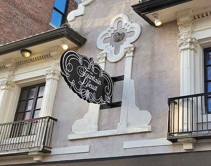 The elegant signage outside beckons passersby to discover what treasures await beyond those historic doors.