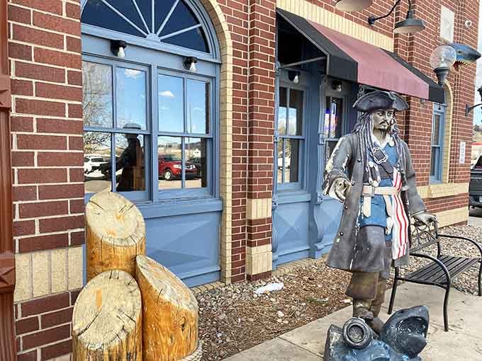 A pirate statue greets you outside because apparently even buccaneers appreciate quality seafood when they find it inland.