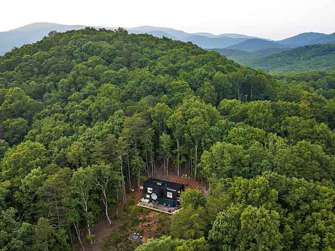 Nestled among endless trees, this architectural marvel sits peacefully remote yet surprisingly accessible for your mountain escape adventure.