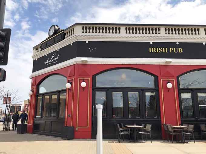 The corner location catches sunlight beautifully, making this red and black exterior impossible to miss while driving past.