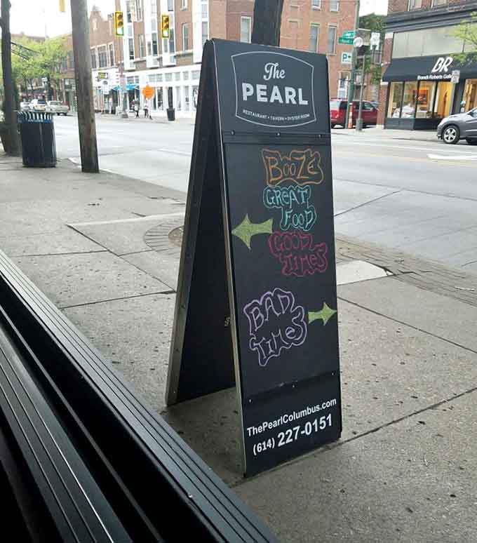 Even the sidewalk sign radiates personality, promising booze, great food, good times, and exactly what's waiting inside.