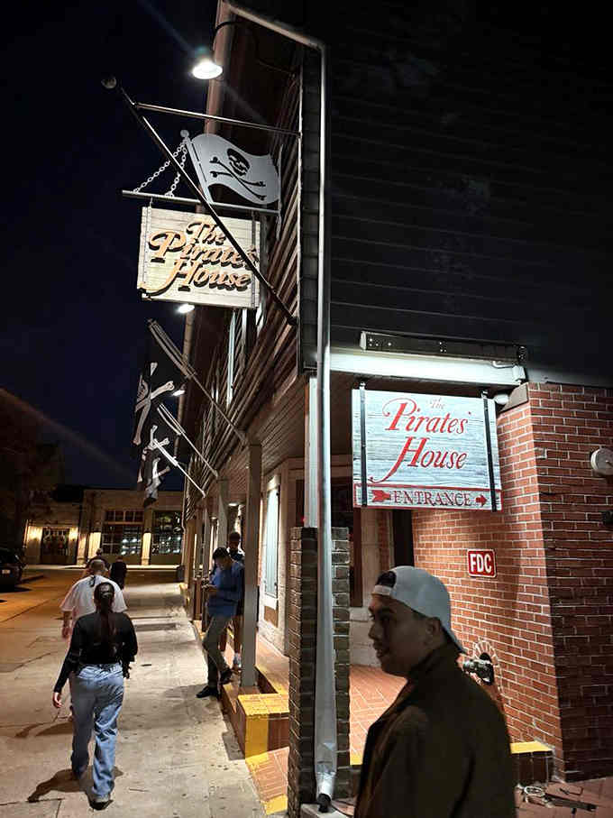 The Jolly Roger flies high as guests gather below, drawn by the promise of adventure served with exceptional Southern hospitality.