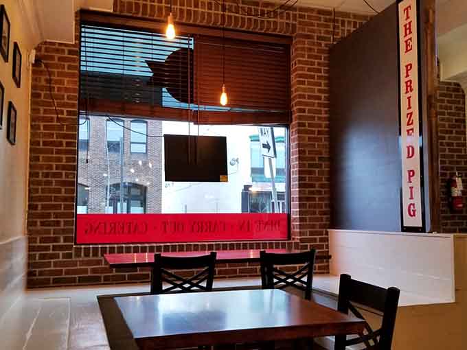 Window seating offers natural light and people-watching opportunities while you enjoy your perfectly smoked feast today.