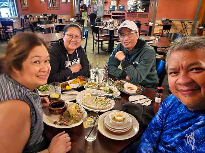 Happy diners sharing a meal together, which is really what great restaurants are all about when you strip away everything else.