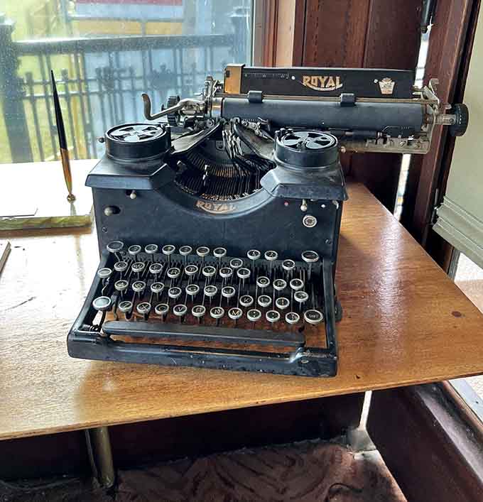 An antique Royal typewriter sits ready, reminding us that important messages once required thought, effort, and correction fluid in bulk quantities.