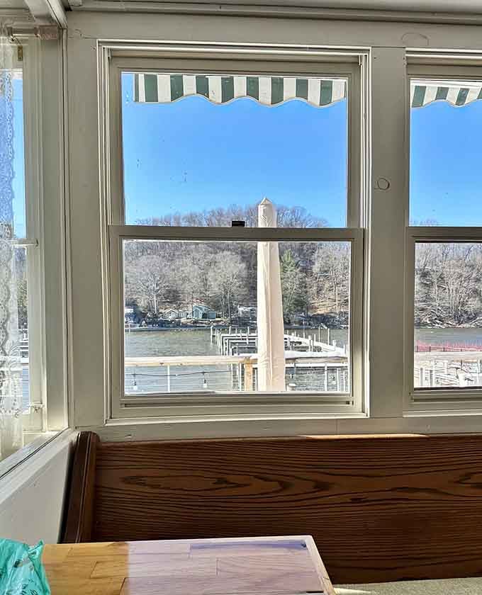 Window seats frame views of the harbor and lighthouse, proving location matters almost as much as food.