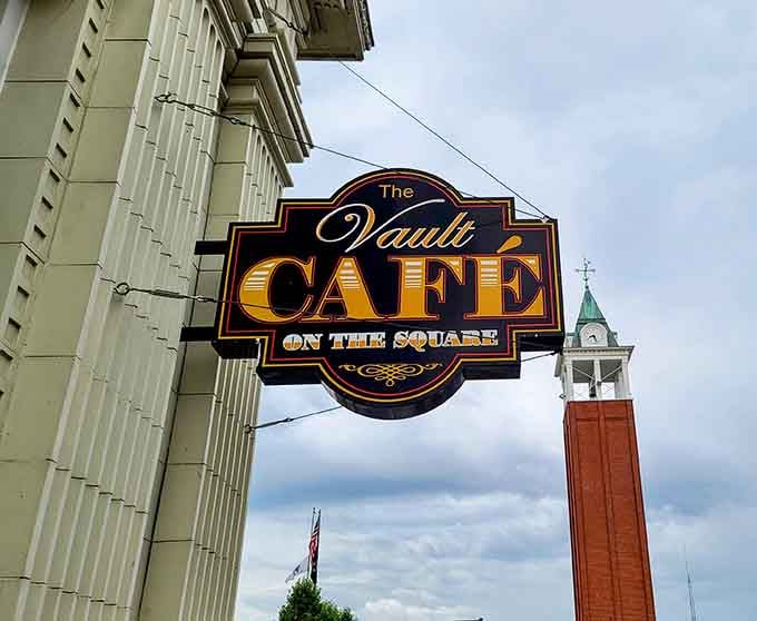 The Vault Cafe sign hanging proud, beckoning hungry travelers to discover where history meets hash browns on the square.