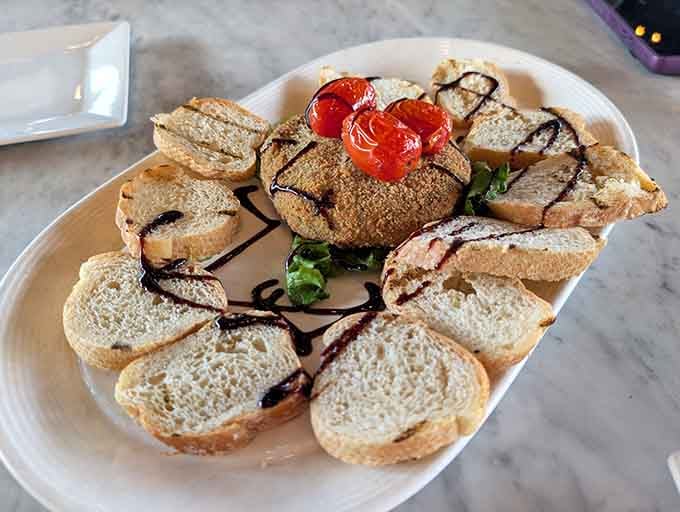 Goat cheese crostini arranged in a circle like some delicious, edible Stonehenge you're encouraged to destroy.