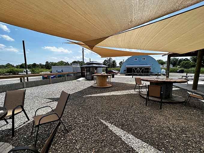 Shade sails and wooden beams creating the kind of outdoor dining room Mother Nature would approve of.