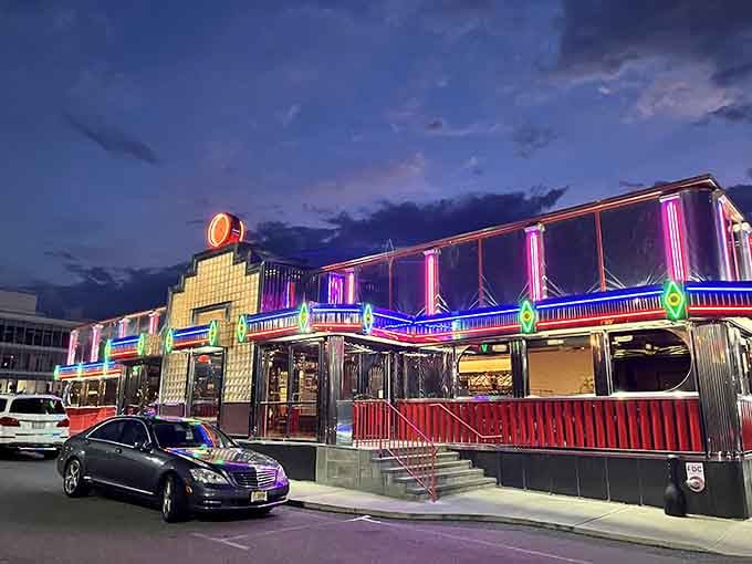 When twilight falls and those neon lights ignite, this chrome palace transforms into pure roadside magic that beckons travelers homeward.