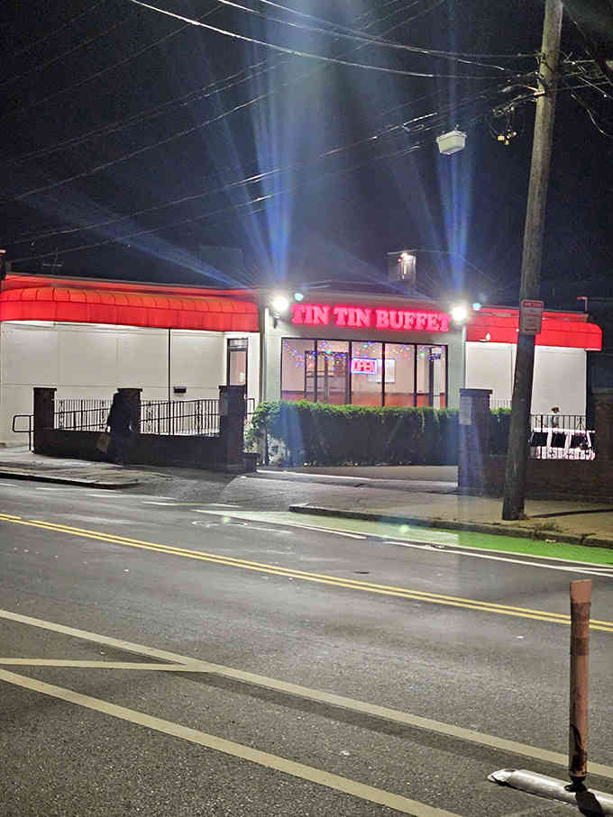 Glowing at night like a delicious lighthouse, guiding hungry souls to their all-you-can-eat destiny with welcoming warmth.