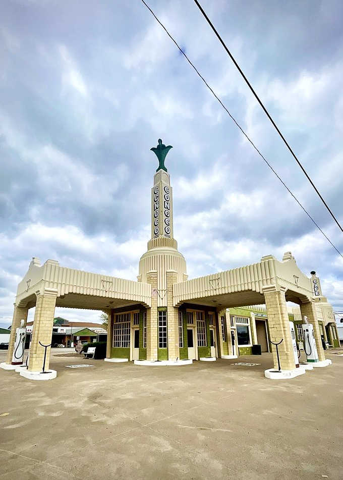 The full architectural spectacle with soaring tower and canopy, proving gas stations once aspired to be landmarks worth remembering.