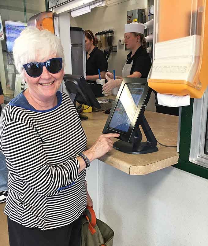 That smile says it all: another satisfied customer who just discovered what burgers are supposed to taste like.