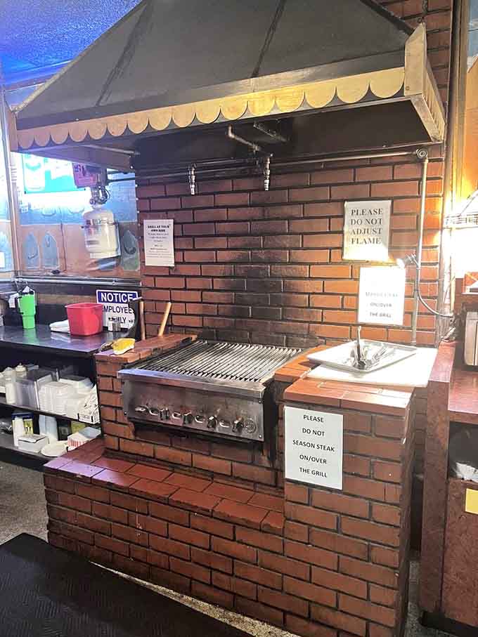 The brick-framed grill station where magic happens and diners become chefs, one steak at a time.