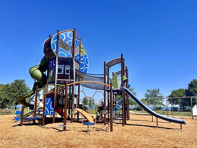 Sherod Park's playground equipment towers over the sandbox like a colorful fortress of childhood joy and slides.