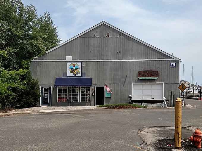 The unassuming exterior hides automotive treasures inside&mdash;never judge a museum by its humble barn-like appearance, friends.