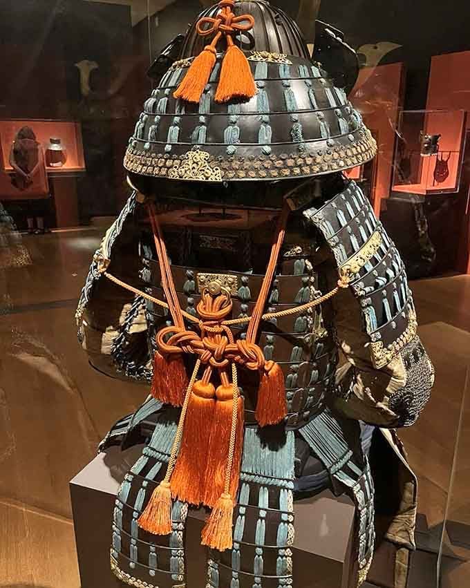 Samurai armor standing guard over the gallery, silently judging your posture and commitment to personal discipline every single day.