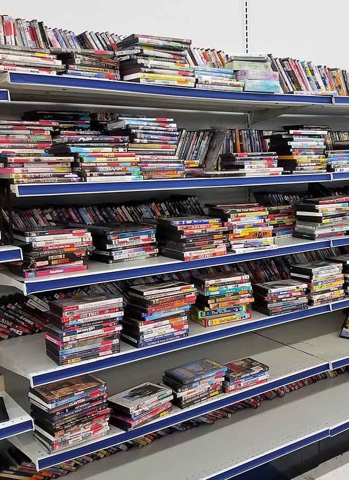 DVDs stacked for movie lovers who appreciate owning films without monthly subscription fees and buffering nightmares.