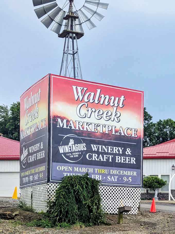 The windmill-topped sign announces your arrival at flea market heaven, open seasonally for your treasure-hunting pleasure.
