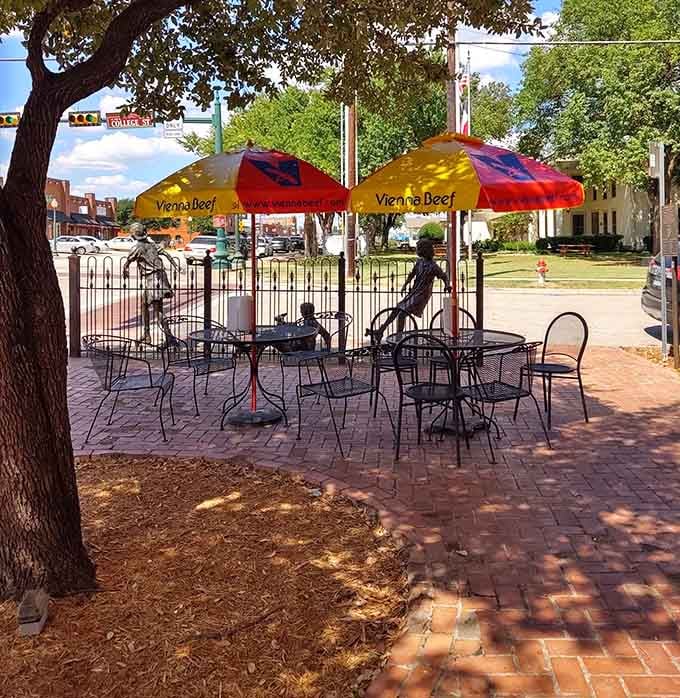Outdoor seating under colorful umbrellas lets you enjoy your sandwich while soaking up downtown Grapevine's charming atmosphere.