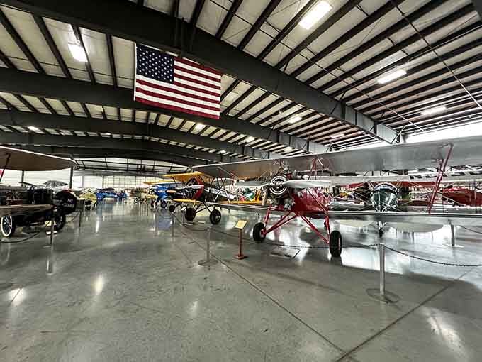 Row after row of perfectly preserved aircraft under the American flag, history standing at attention.