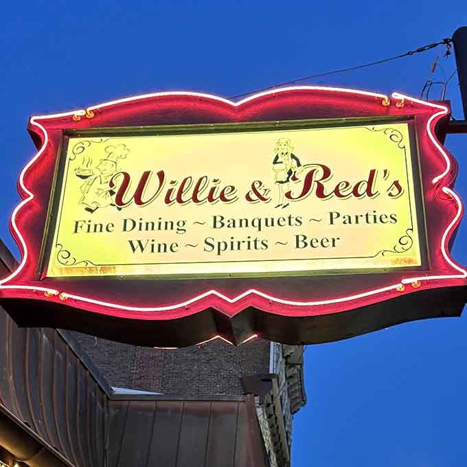 The vintage neon sign glows with promise, beckoning travelers and locals alike to discover what all the delicious fuss is about.