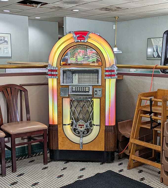 A vintage jukebox adding authentic retro charm, because great diners understand that atmosphere matters almost as much as the food.