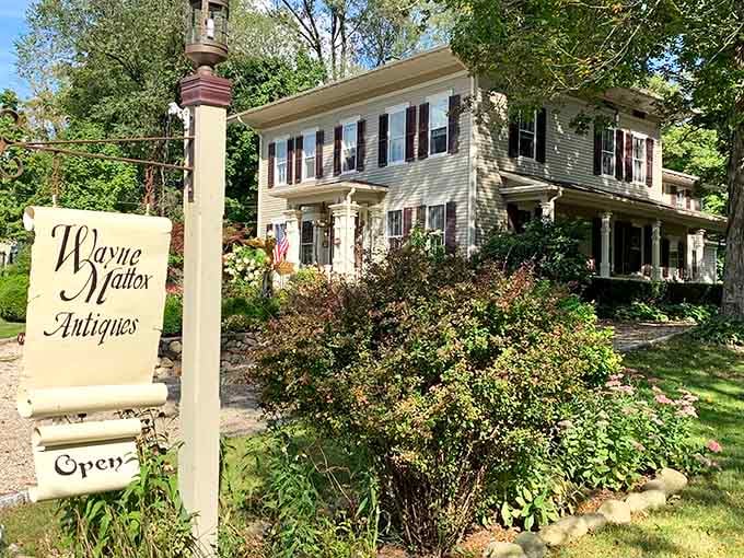 That elegant sign and historic house whisper sophistication, where every piece inside has a story worth hearing.