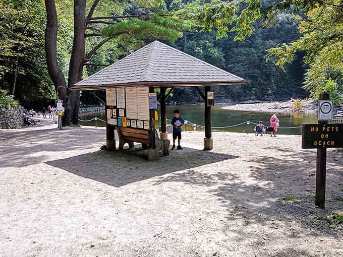 Information kiosks keep visitors informed while kids splash in the shallow waters behind them on warm days.