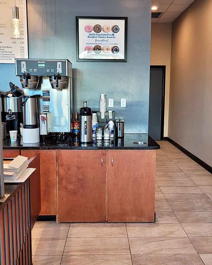 The coffee station stands ready to provide the perfect liquid companion to whatever sugary masterpiece you've just selected.