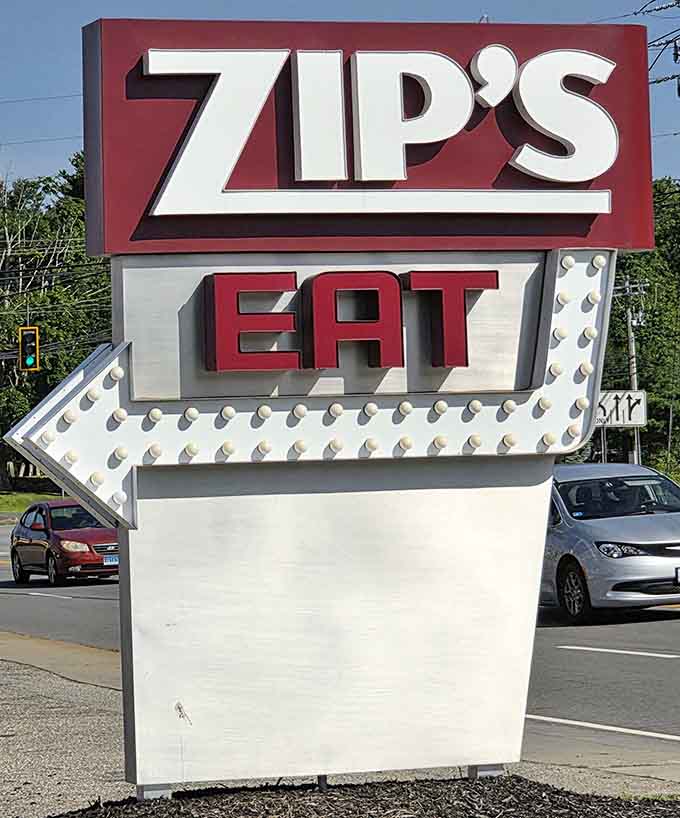 That roadside sign points the way to breakfast salvation with vintage arrow flair and timeless appeal.