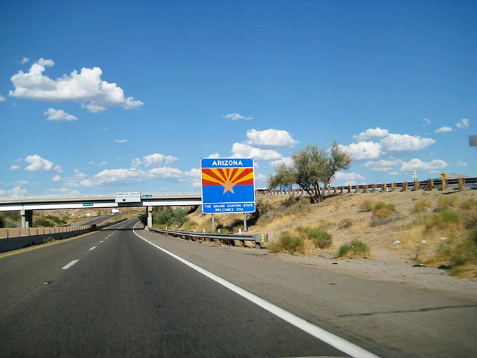 Modern infrastructure meets timeless desert landscape, and somehow that welcome sign makes it all feel just right together.