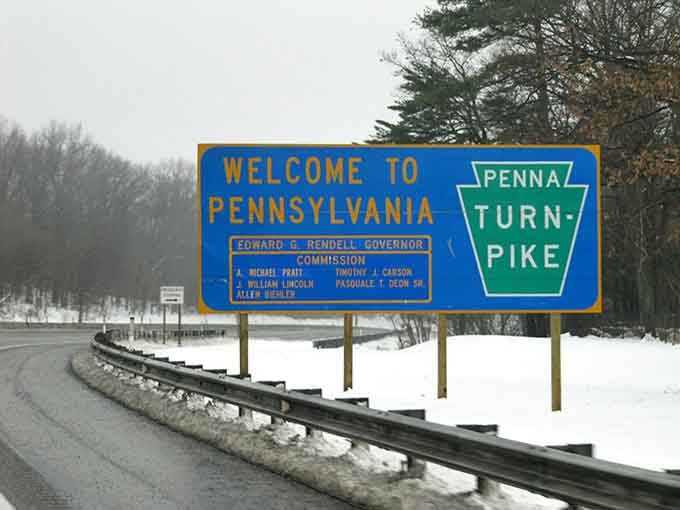 The Turnpike sign signals you're about to experience one of America's most historic and scenic highway journeys.