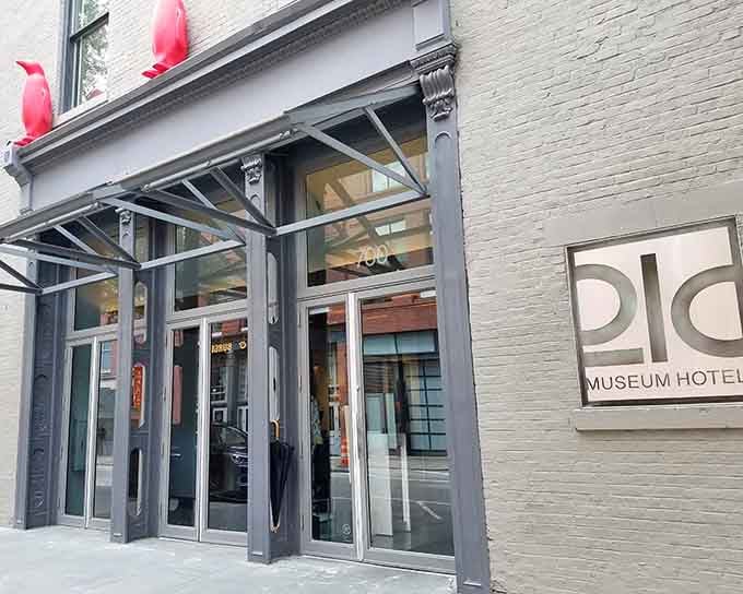 Modern glass doors welcome you into a world where contemporary art meets Southern hospitality in downtown Louisville.