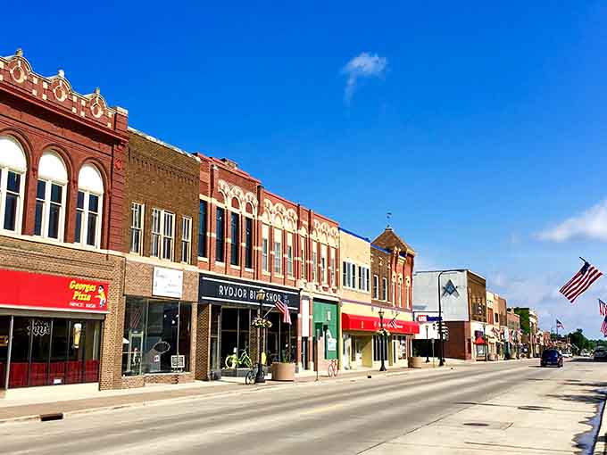 Classic brick storefronts under endless blue skies prove small-town charm never goes out of style here.