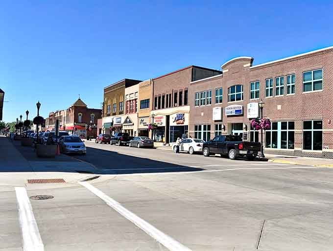 Modern storefronts meet classic brick charm in this welcoming downtown where your dollar stretches further than expected.