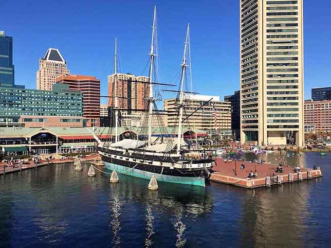 Historic ships and sparkling water create a postcard-perfect scene where city energy meets maritime charm and endless exploration.