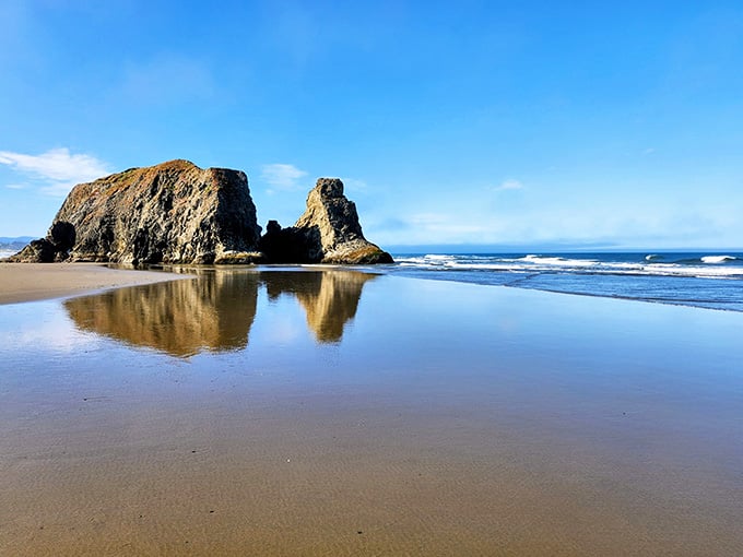 When rocks cast perfect mirror reflections on wet sand, you know Mother Nature's showing off her photography skills.