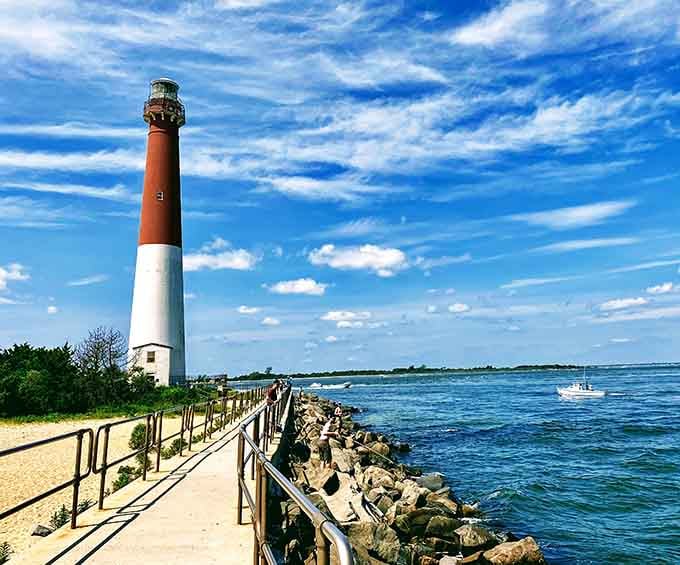 That red and white tower standing against endless blue sky looks like a peppermint stick guarding the Jersey Shore.