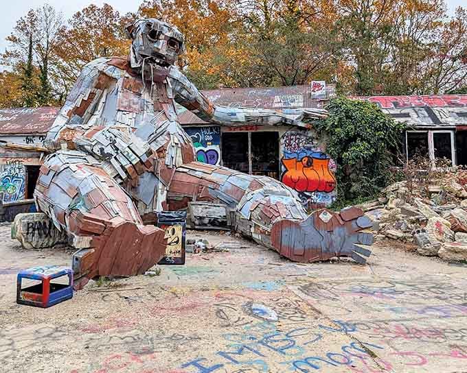 When recycled metal becomes prehistoric art, you get this magnificent T-Rex towering over a graffiti-covered wonderland of creativity.