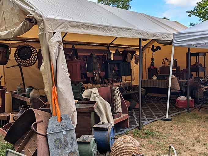 Under canvas tents, vintage treasures spill out like memories from your grandmother's attic, waiting to be rediscovered.