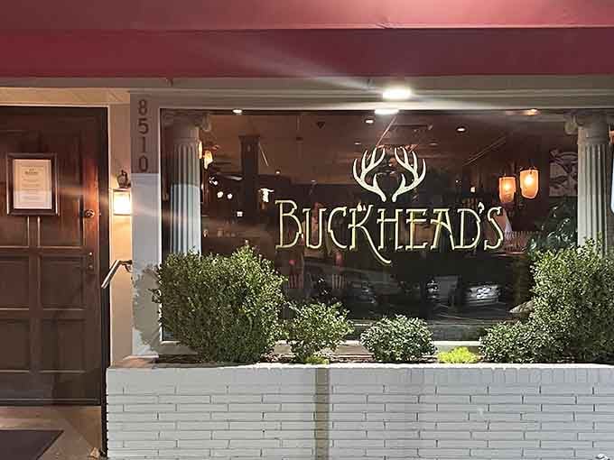 That elegant antler logo glowing in the evening light promises serious steaks hiding behind those welcoming doors.