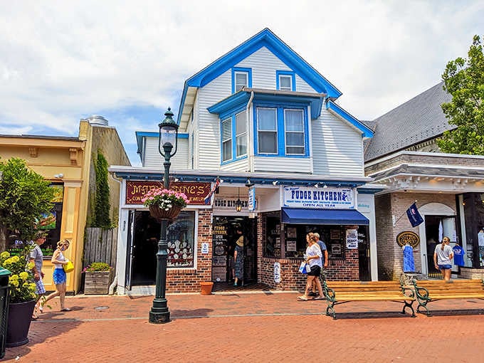 Victorian storefronts painted in cheerful blues create a seaside scene that rivals any English coastal village charm.